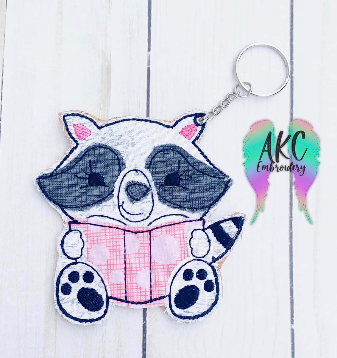ITH racoon key chain 2025 – AKC Embroidery and Digital Designs