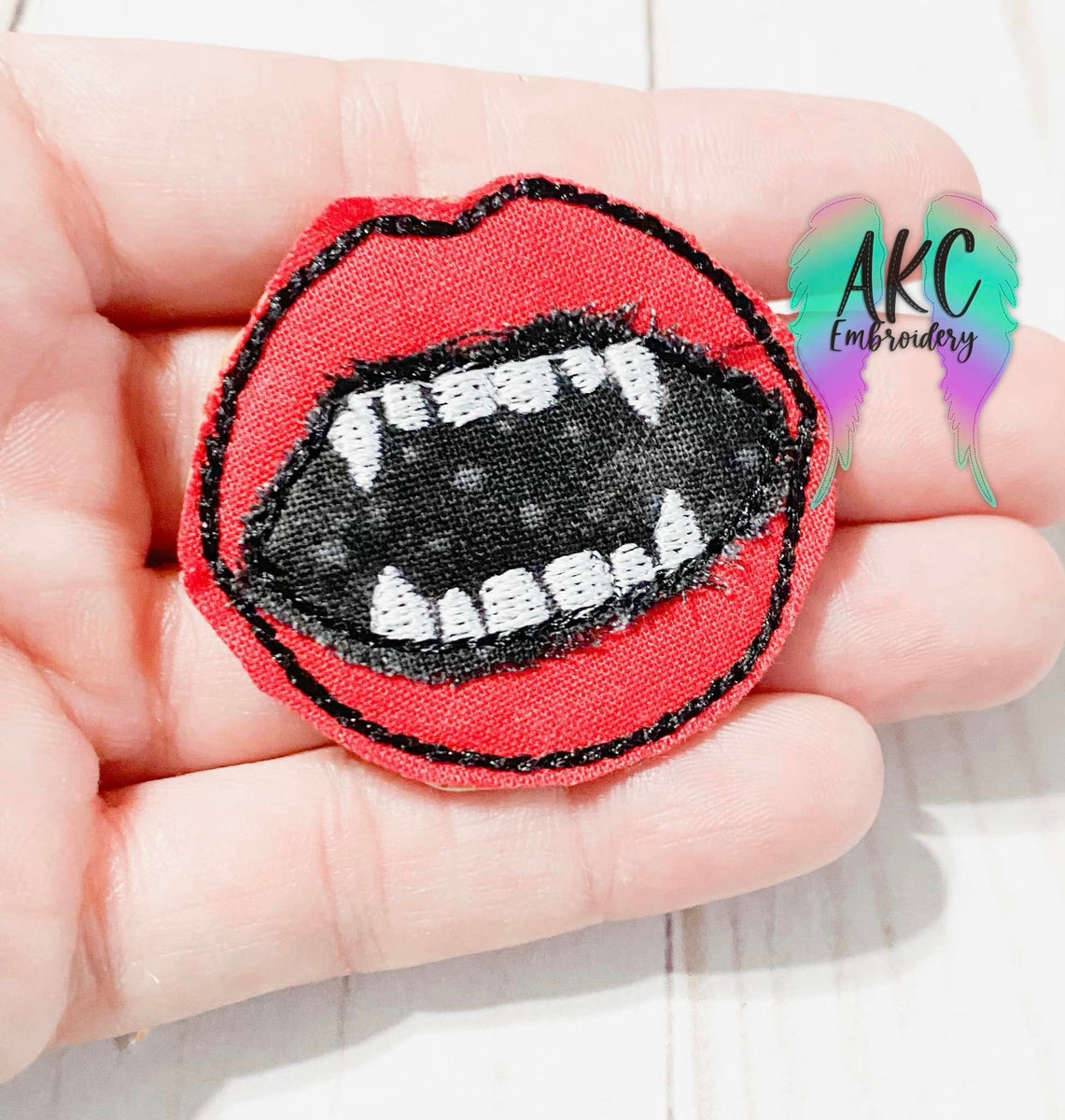 ITH vampire teeth magnet 2023 – AKC Embroidery and Digital Designs