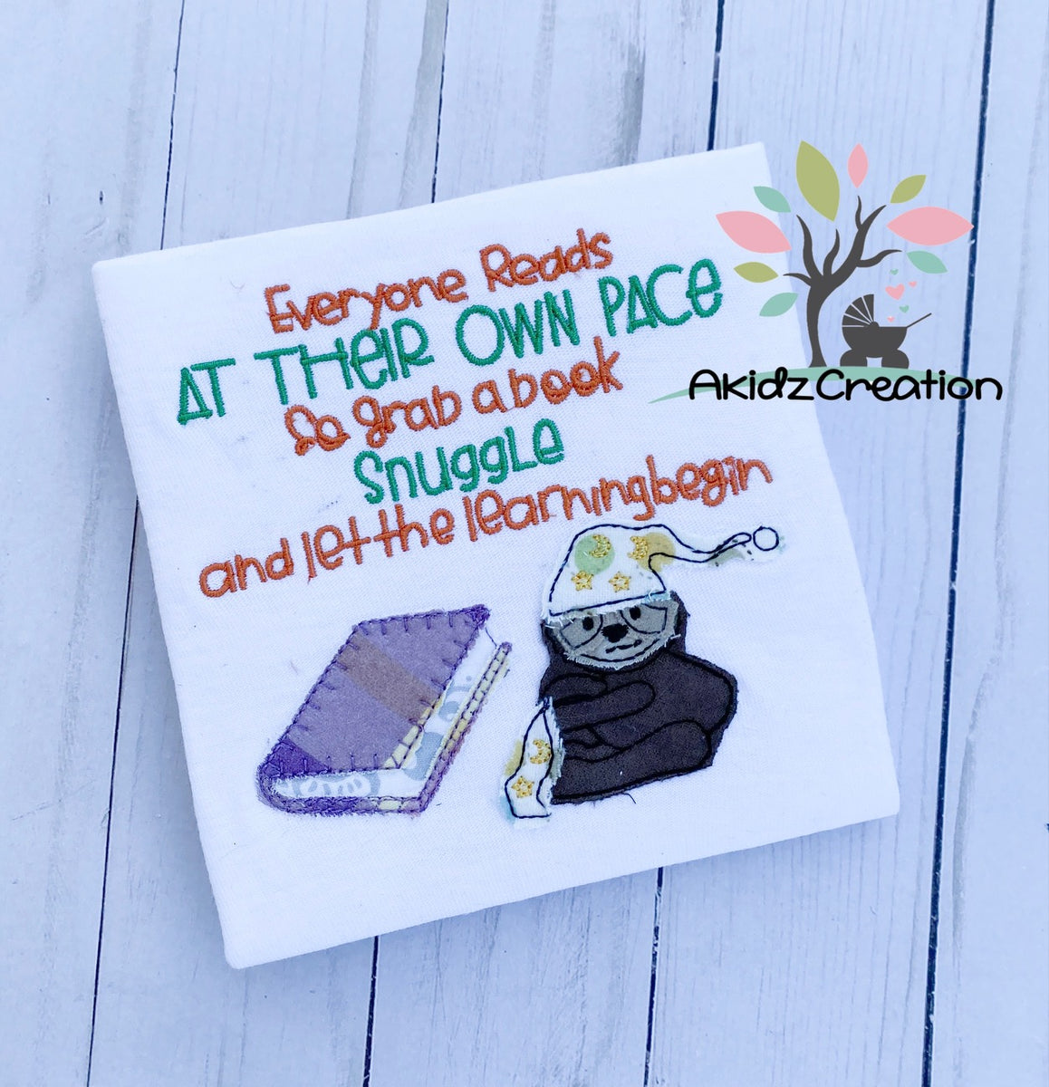 Sloth reading pillow 2019 – AKC Embroidery and Digital Designs